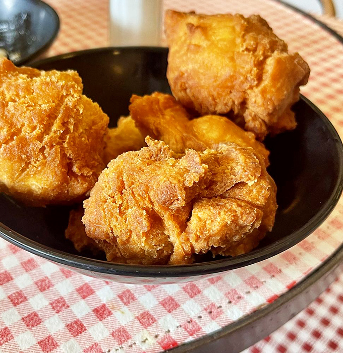 Comfort food algebra: crispy exterior + fluffy interior = cornbread perfection that deserves its own food group.