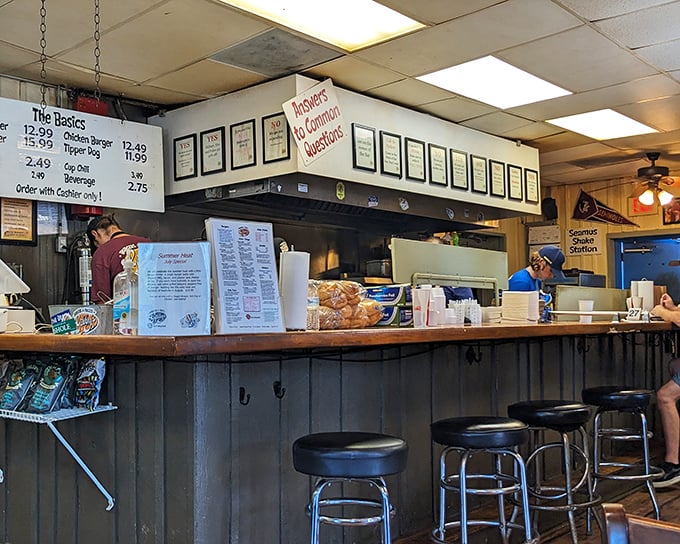 The command center where burger dreams become reality. Those framed accolades aren't just decoration&mdash;they're well-earned battle medals.
