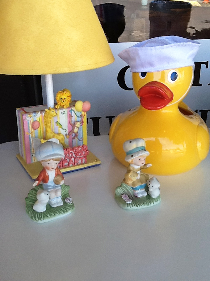 Whimsy meets nostalgia with this sailor-capped rubber duck and porcelain figurines – childhood memories reimagined as charming home decor.