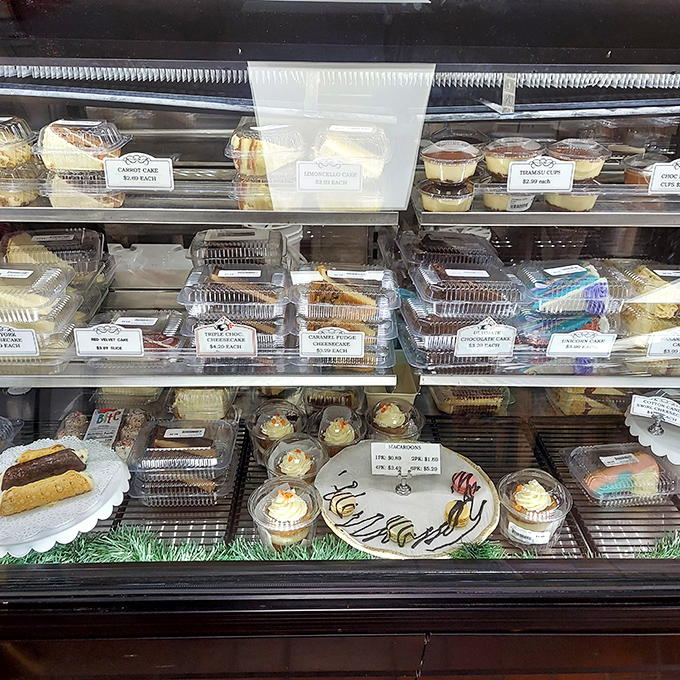 A dessert case that whispers sweet nothings to your willpower. Those tiramisu cups are practically begging to join your seafood haul.