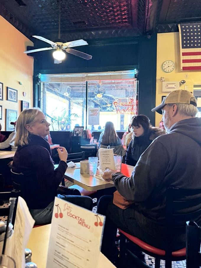 The true heart of Dot's&mdash;where neighbors become friends over coffee and comfort food beneath the watchful gaze of an American flag.