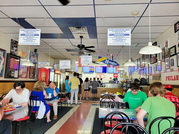 The lunch rush &ndash; a symphony of satisfied munching and Eagles talk. These tables have heard decades of Philly sports debates.