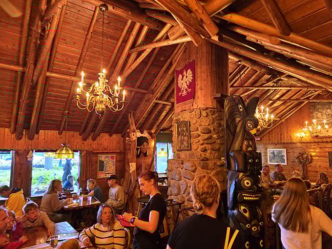 The rustic wooden interior doesn't just house diners&mdash;it envelops them in a century-old story told through carved beams and antler chandeliers.