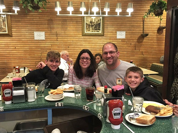 Family memories being made one bite at a time. Those smiles say everything about the universal language of good food shared together.