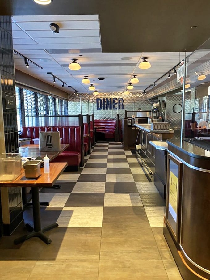 Classic diner aesthetics meet upscale dining in a space that feels both nostalgic and contemporary. Checkered floors never looked so sophisticated.