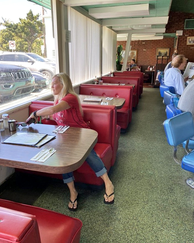 Not just a dining room but a community gathering spot where strangers become neighbors over coffee refills and the shared language of "pass the syrup."