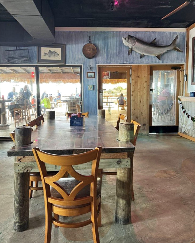 Mounted fish watch over diners like culinary guardian angels, silently approving your excellent taste in waterfront dining.