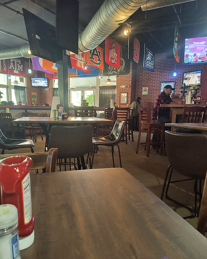 College pennants and exposed ductwork create that perfect "neighborhood joint" atmosphere. The kind of place where everybody eventually knows your name.