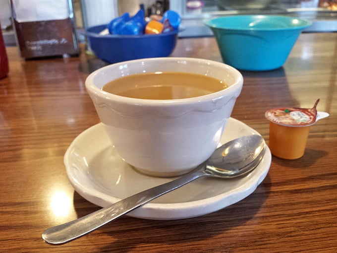 The humble coffee cup—where diner magic begins, refills are plentiful, and life's problems seem temporarily solvable.