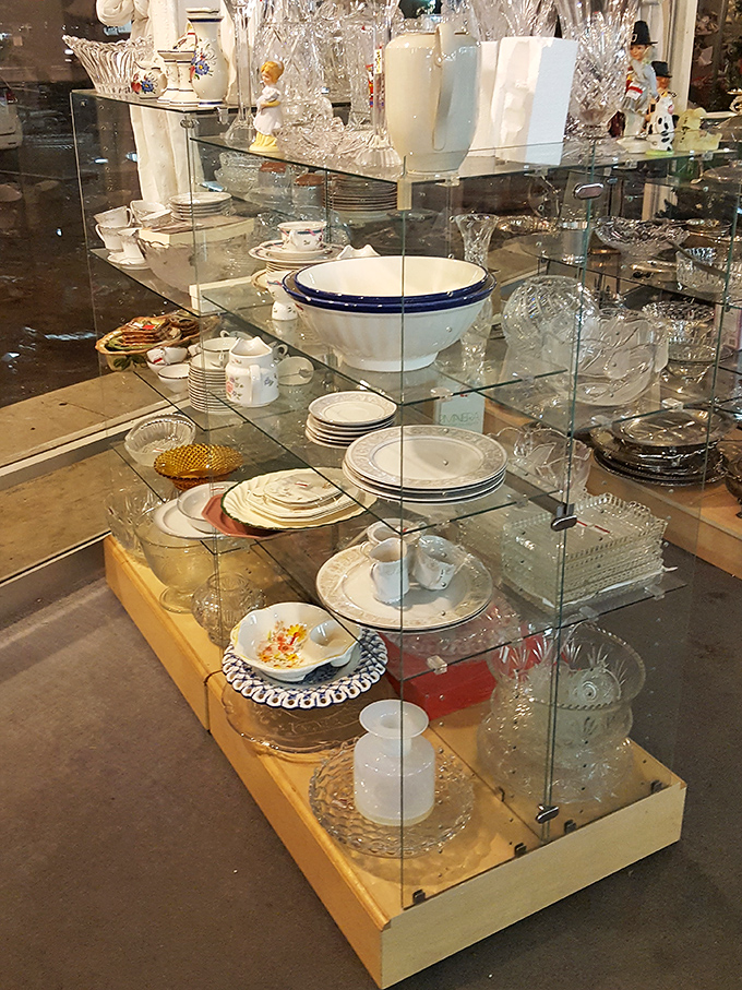 Crystal, china, and everyday dishes create a tableware wonderland. These pieces once graced other dining tables and now await new dinner parties and family gatherings.