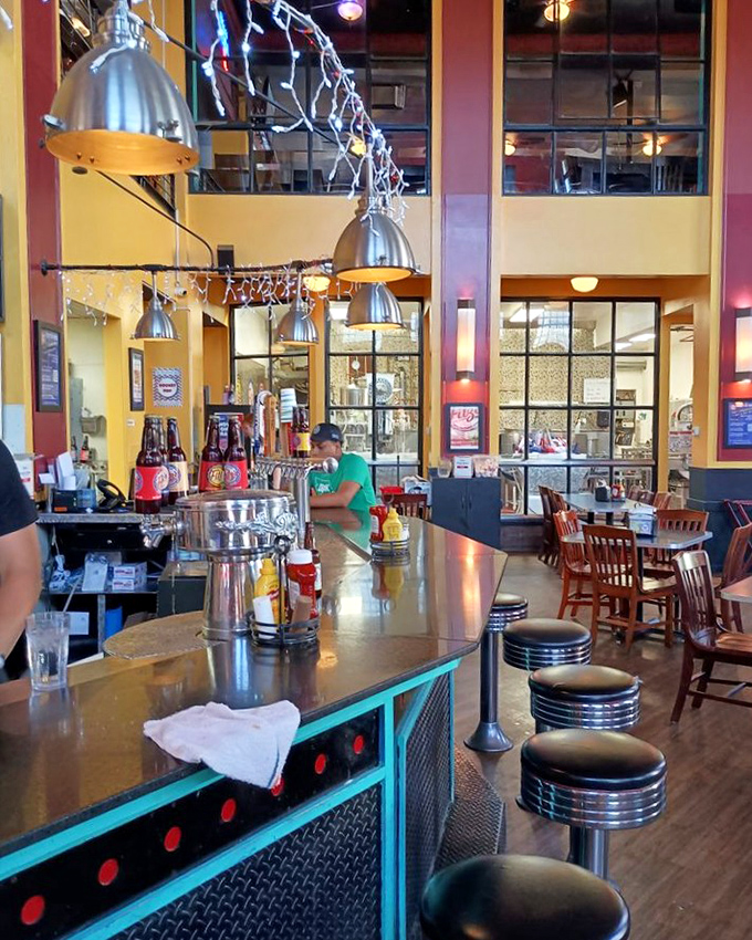 The downstairs bar combines retro diner aesthetics with industrial chic, creating the perfect backdrop for root beer-fueled conversations. 