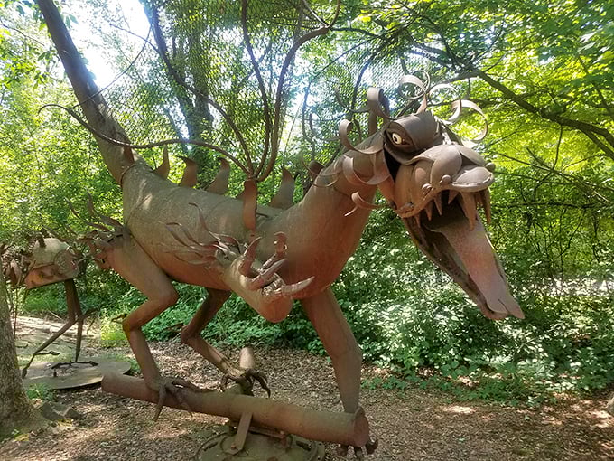 This ferocious metal beast looks ready to pounce from the forest path, its rusty jaws agape in a prehistoric roar that echoes through the trees.