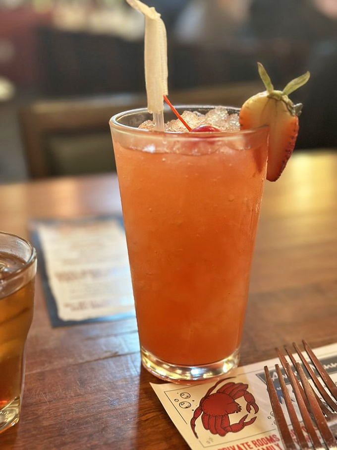 This cocktail arrives looking like a Virginia Beach sunset decided to take liquid form and make your evening infinitely better.