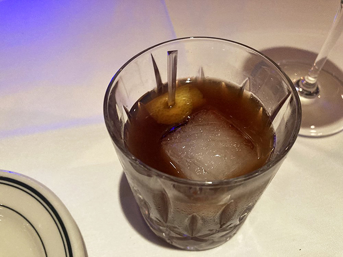 An old fashioned that means business &ndash; amber liquid, one perfect ice cube, and the promise of relaxation after the first sip.