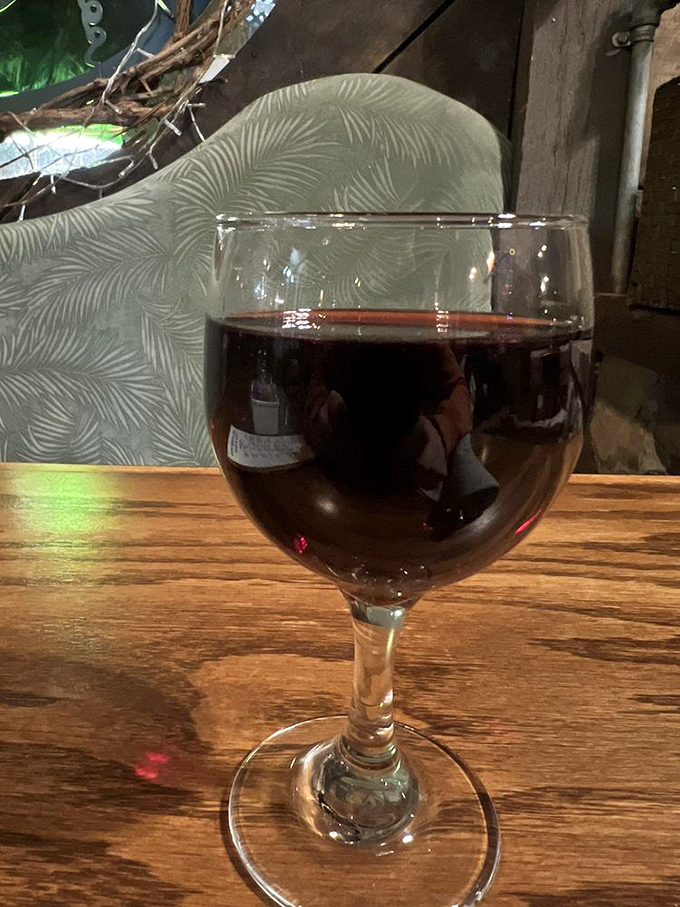 Sometimes the perfect dining companion is a glass of good red wine. Against the backdrop of historic wood, it's practically a time-travel experience.
