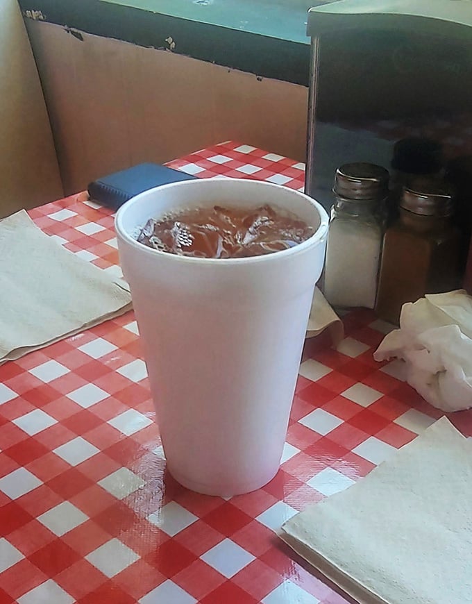 Sweet tea in a styrofoam throne, sitting on classic red-checkered royalty. In South Carolina, this isn't just a drink &ndash; it's a birthright.