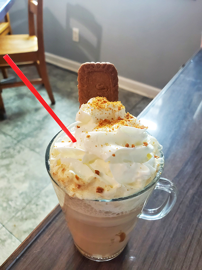 Coffee transformed into dessert disguised as a morning beverage. That cookie garnish isn't fooling anyone - this is happiness in a mug.
