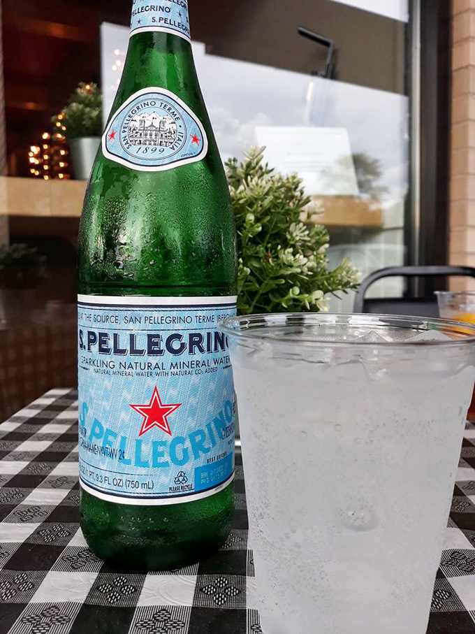 Nothing says "authentic Italian experience" quite like San Pellegrino on a checkered tablecloth&mdash;a simple pleasure that somehow elevates everything around it.