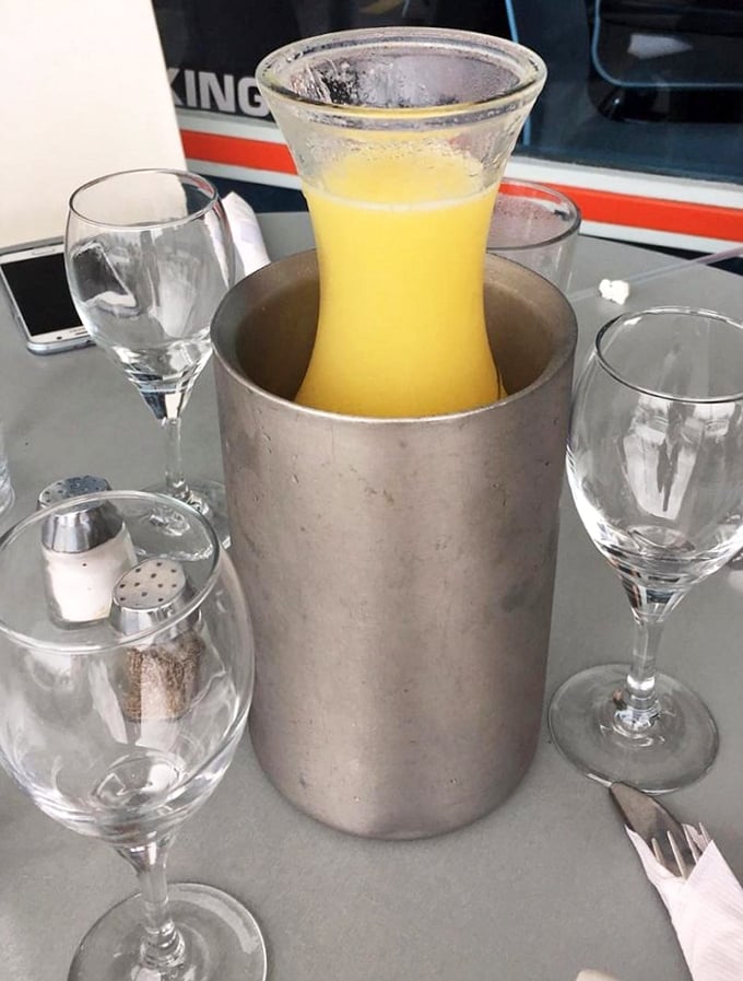 Mimosas served with the kind of presentation that turns brunch from a meal into an event worth celebrating.