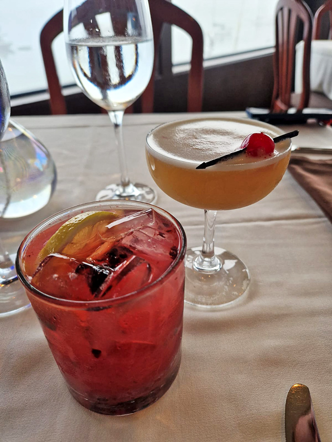 Cocktails that double as liquid artwork&mdash;one ruby red with whispers of citrus, one sunset-hued with a cherry crown. Vacation in a glass.