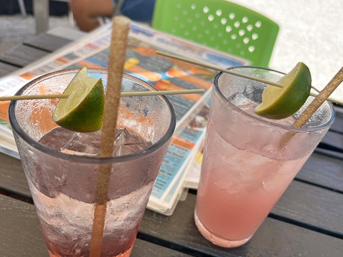 Refreshing drinks with lime wedges standing at attention, ready to complement your seafood feast perfectly.