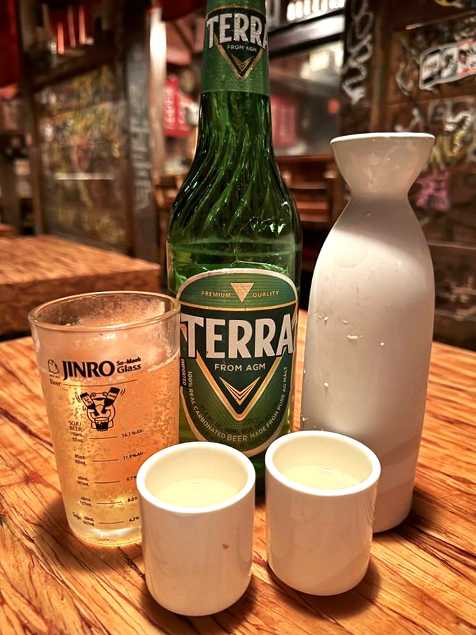 Soju and beer—Korea's dynamic drinking duo. This traditional setup isn't just about alcohol; it's a ritual that transforms strangers into friends by the second pour.