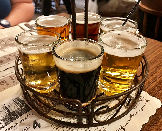 A flight of German beers arranged like a liquid color wheel&mdash;from golden pilsners to that center stout that's darker than my coffee this morning.
