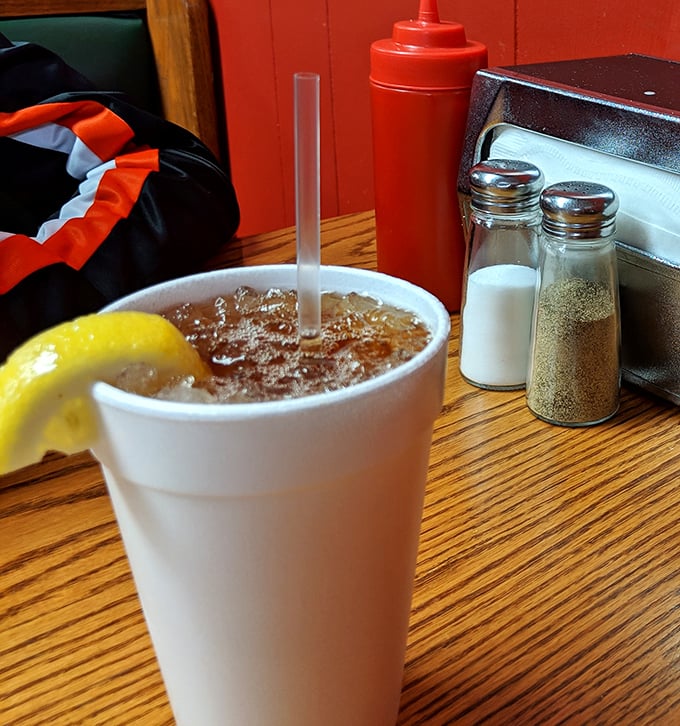 Sweet tea in a plastic cup with a lemon wedge&mdash;the unofficial state beverage of North Carolina and the perfect companion to cut through rich, smoky barbecue.