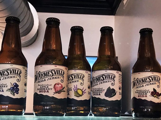 Local Waynesville Soda Jerks craft sodas line up like colorful soldiers, ready to offer a refreshing alternative to your standard breakfast beverages.