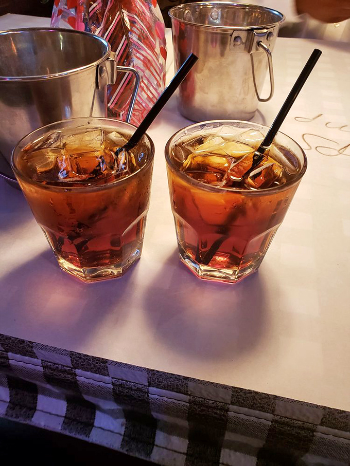 Two glasses of amber comfort with ice cubes that know their job. In a world of complicated cocktails, sometimes straightforward is the ultimate sophistication.