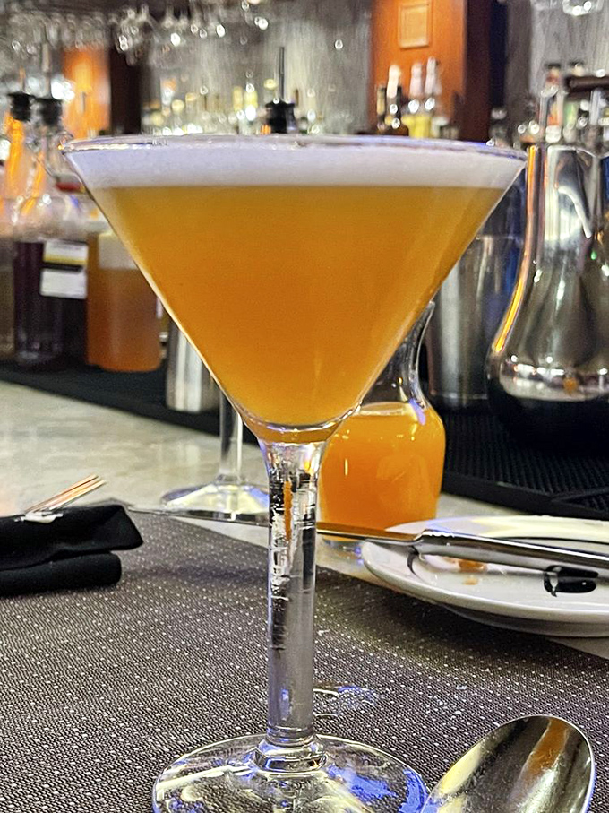 A perfectly crafted cocktail that glows like Georgia sunset. This isn't just a drink; it's liquid anticipation for the feast that follows.