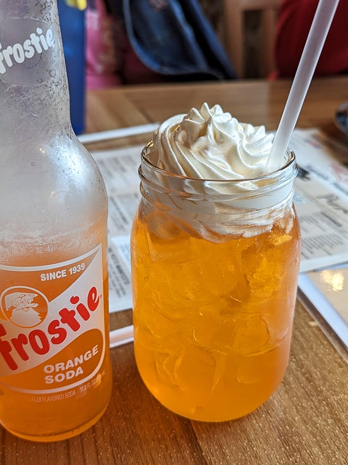 Nothing says "Midwest charm" quite like an orange cream soda served in a mason jar with a mountain of whipped cream. Nostalgia in liquid form.