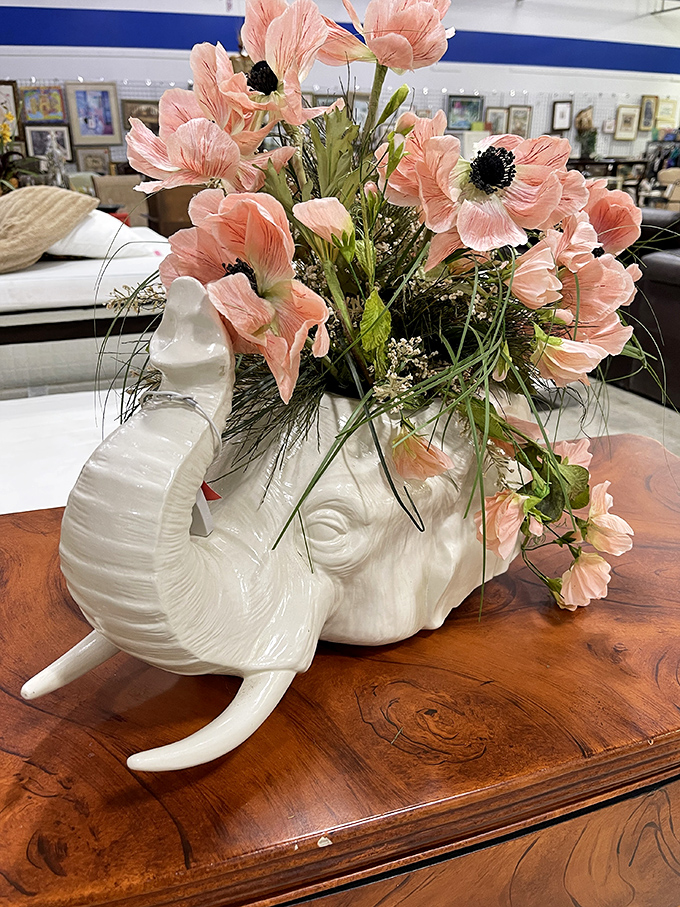 Where else but Florida would you find a ceramic elephant planter filled with silk poppies? This whimsical piece screams "conversation starter" for your entryway table.