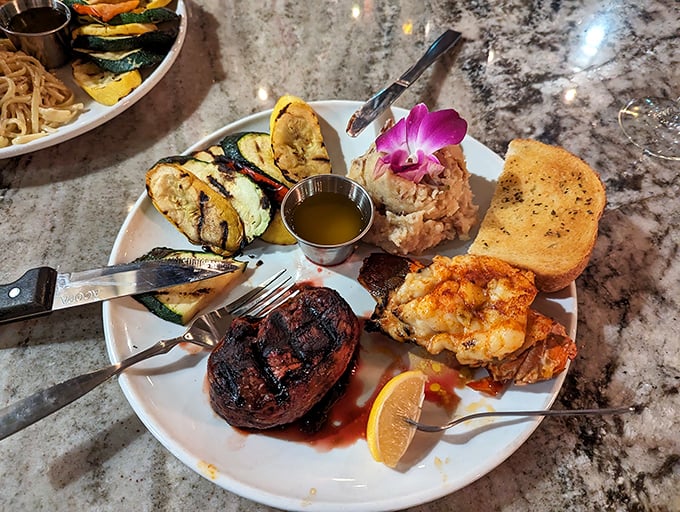 Surf meets turf in this culinary love story. A perfectly seared filet mignon shares the spotlight with succulent seafood in a plate that screams "special occasion."