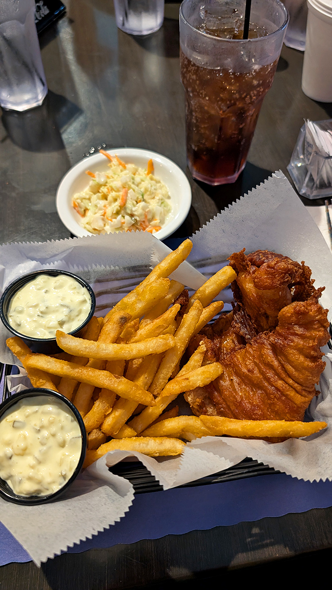 Fish and chips that would make a British pub jealous, with golden batter so crisp you can hear it crackle from three tables away.