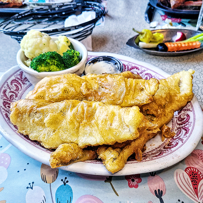 Golden-battered fish that shatters at first bite, served with vegetables that remind you that balance in all things&mdash;even indulgence&mdash;has merit.
