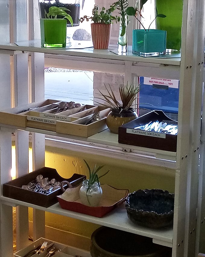Organized chaos of flatware finds—where mismatched becomes "eclectic collection" and every fork tells a different dinner party story.