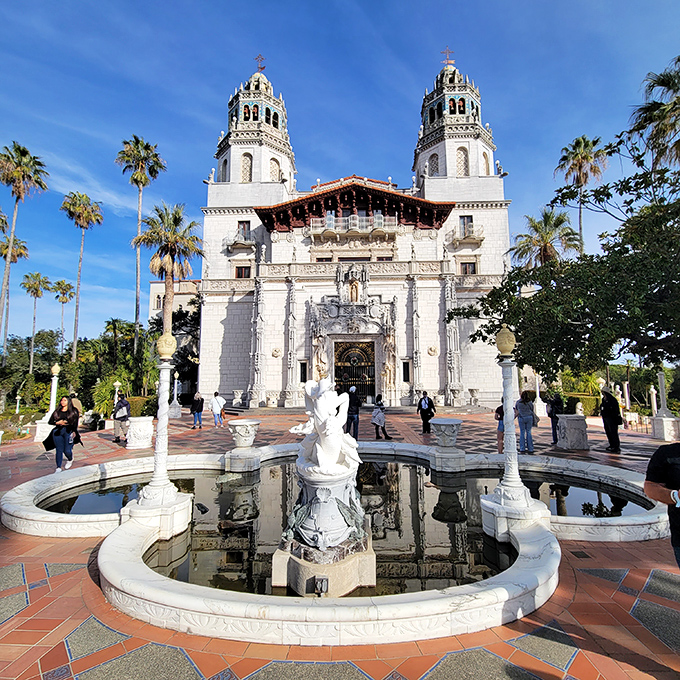 The castle's entrance fountain offers visitors their first taste of opulence, like an architectural appetizer before the multi-course feast of extravagance waiting inside.
