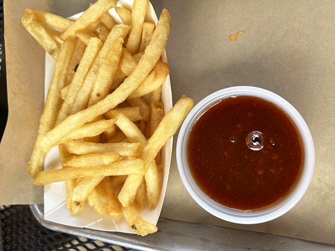 French fries so perfectly golden they deserve their own Instagram account, with dipping sauce playing the essential supporting role.
