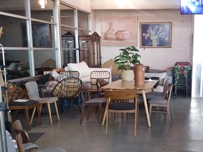 Mid-century modern meets eclectic comfort in the furniture section. That wooden table has hosted more family dinners than most restaurants.