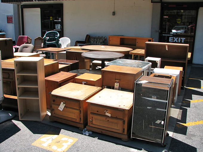 Furniture purgatory where wooden dressers and nightstands await salvation. Someone's "no longer needed" is about to become your "perfect fit."