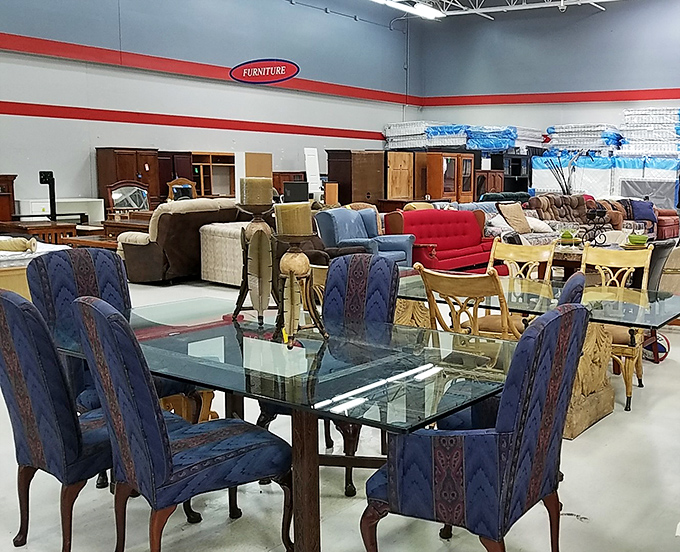 Dining sets and armchairs arranged like a life-sized dollhouse. That glass table has hosted countless meals in its first life.