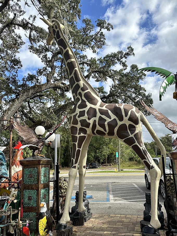 "You must be this tall to enter the yard." This towering giraffe serves as both guardian and greeter at the entrance.