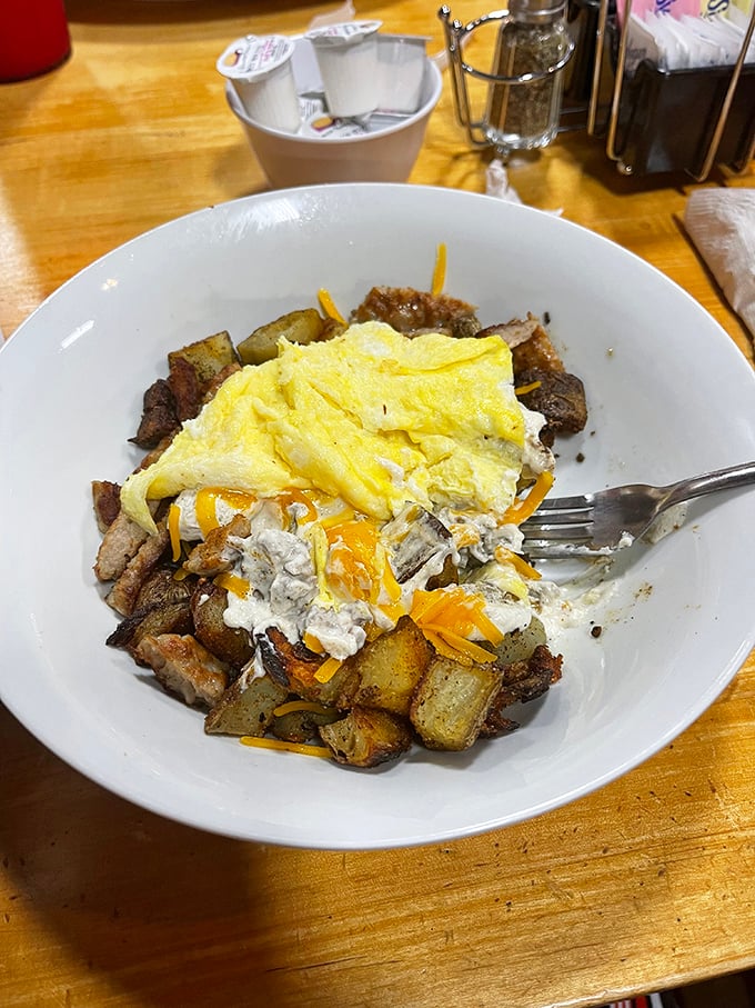 A skillet that tells the story of comfort food in one perfect frame. When potatoes meet eggs and cheese, magic happens on the plate.