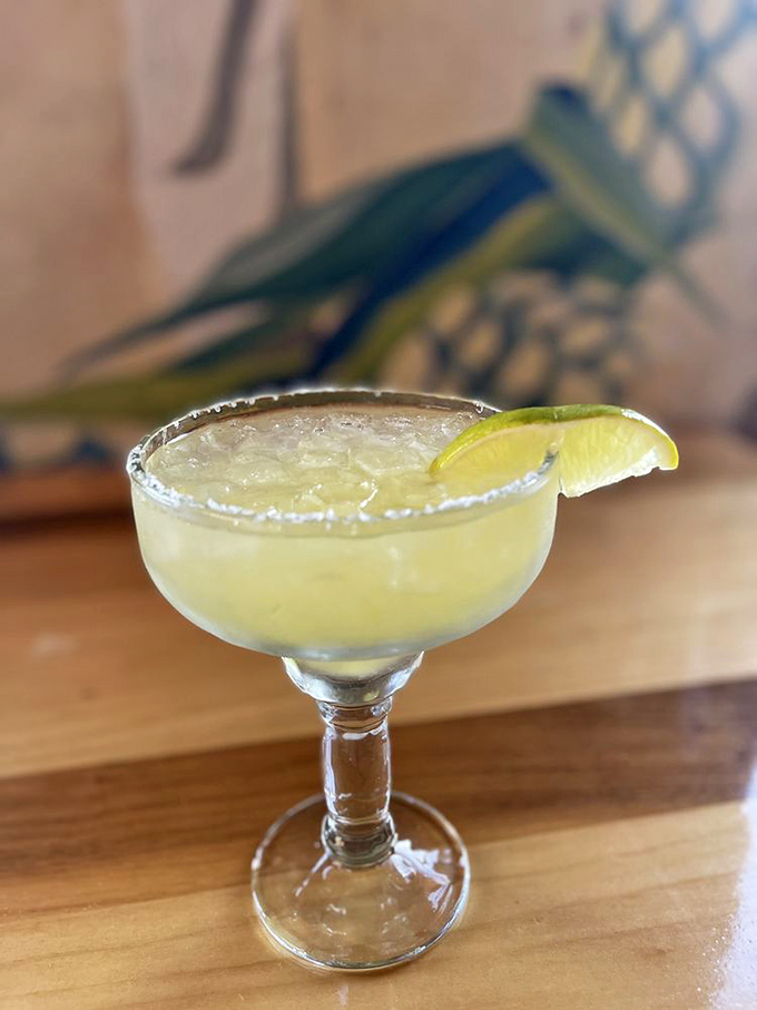 The house margarita arrives like liquid sunshine in a salt-rimmed glass &ndash; tart, strong, and refreshing enough to make you forget you're in 110-degree heat.
