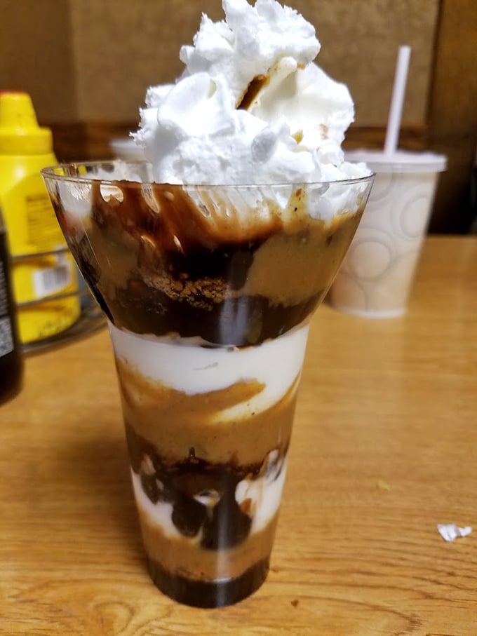 Their layered sundae proves Hot Dog Heaven isn't just about savory delights&mdash;this tower of ice cream, fudge, and whipped cream offers the perfect sweet finale.