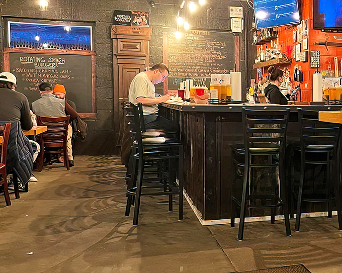 The bar area&mdash;where barbecue pilgrims gather to worship at the altar of smoke and sauce, beneath the glow of TVs and good vibes.