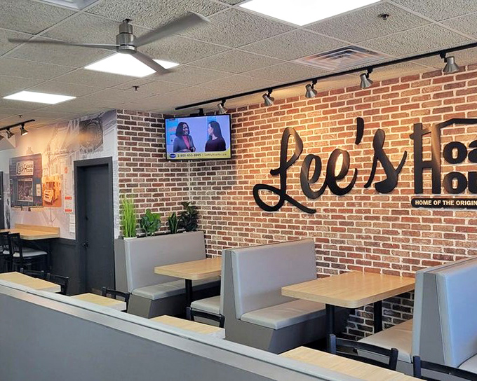 The brick wall interior of newer Lee's locations maintains the charm while adding modern touches. Same sandwich philosophy, slightly updated packaging.