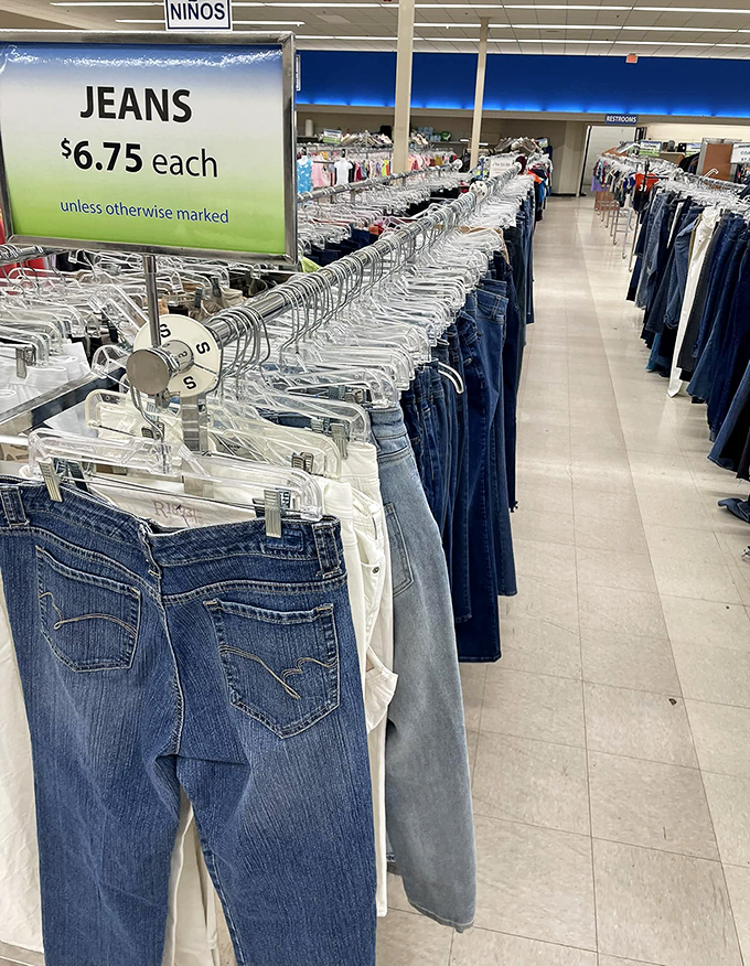 Denim heaven at $6.75 a pair! More jeans than a 90s sitcom wardrobe department, all meticulously organized by size.