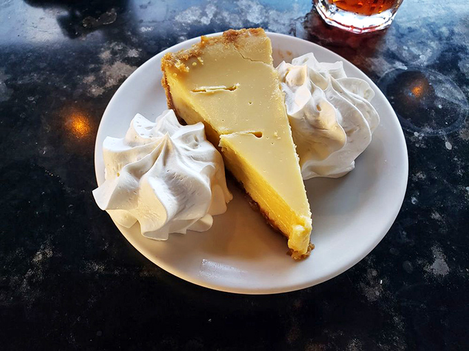 Key lime pie that strikes the perfect balance between tart and sweet, topped with clouds of whipped cream that make every bite a tropical vacation.
